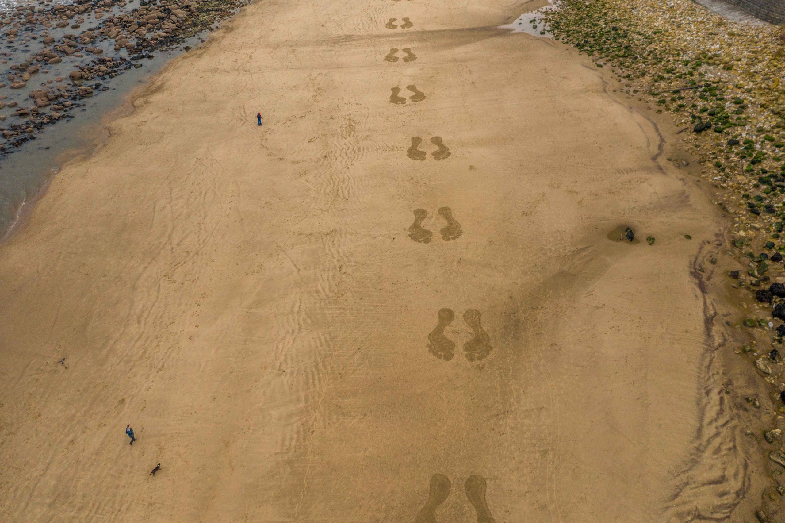 Sand Drawing to raise awareness of cancer crisis for Macmillan Cancer ...