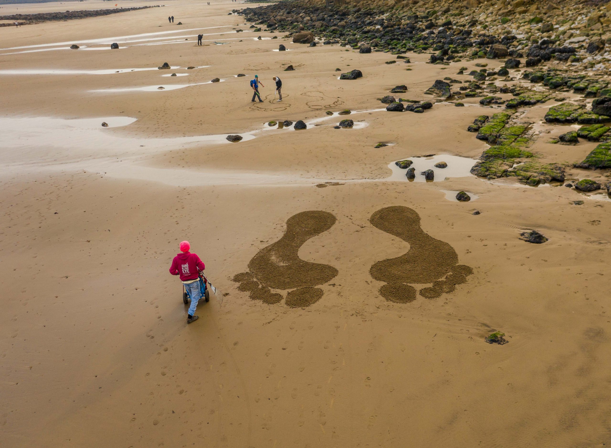 Sand Drawing to raise awareness of cancer crisis for Macmillan Cancer ...